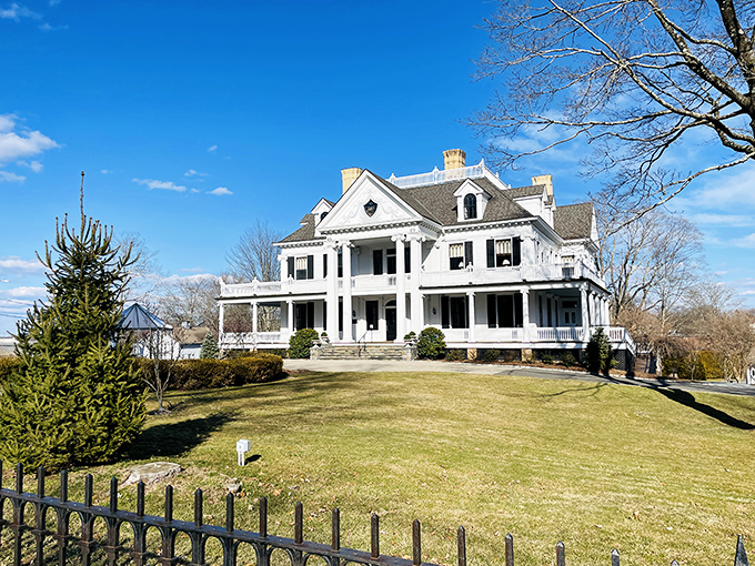 Lounsbury House stands as magnificent proof that white columns never go out of style. This Greek Revival mansion makes your neighbor's "fancy" house look like amateur hour.
