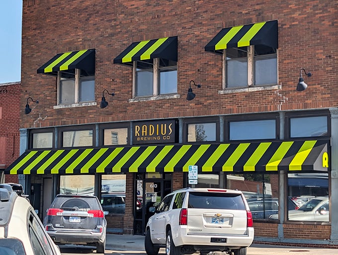 Radius Brewing Company's distinctive black and green awnings signal that craft beer culture has found a comfortable home in small-town Kansas.