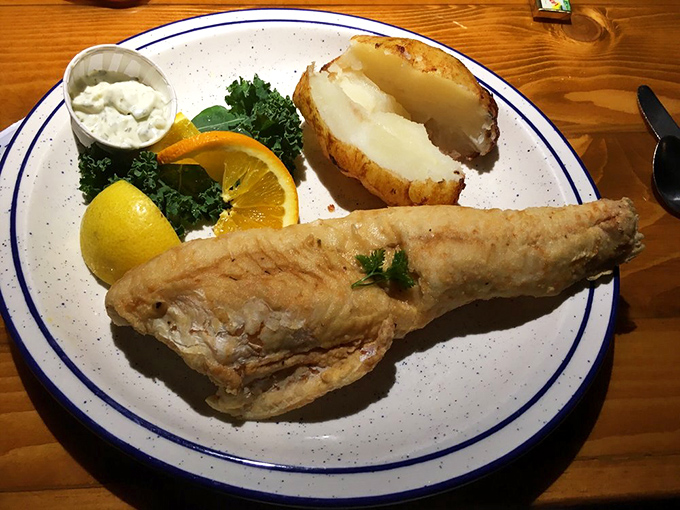 Flaky, tender fish that tastes like it jumped from Table Rock Lake straight onto your plate, with a baked potato standing guard.