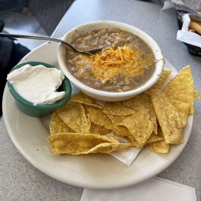 White chicken chili that doesn't need fancy garnishes to impress. Those tortilla chips aren't just for scooping&mdash;they're edible spoons for liquid comfort.