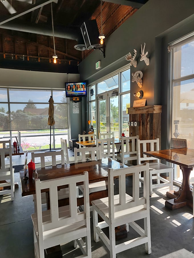 Sunlight streams through windows illuminating these white chairs like they're waiting for food celebrities to arrive&mdash;and in a way, you are one.