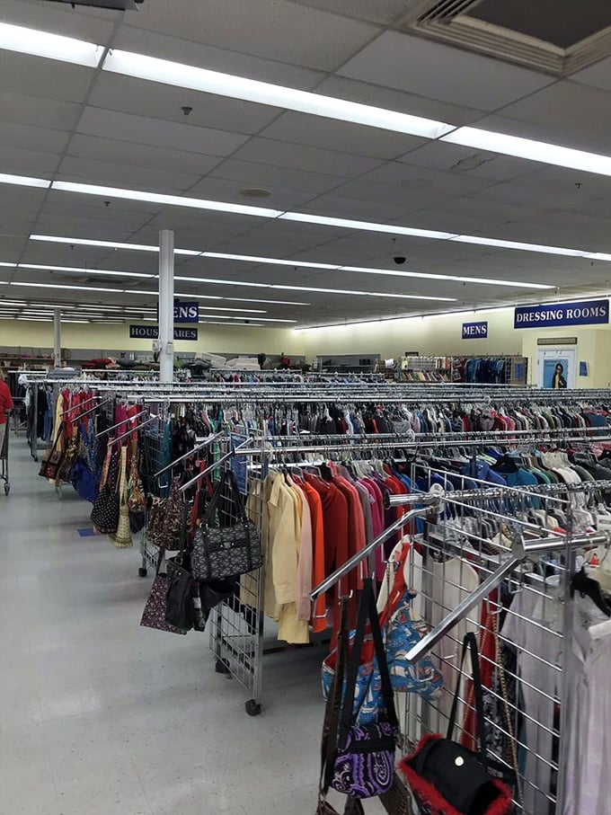 The women's department stretches into the horizon like a fabric rainbow, organized with military precision that makes treasure-hunting surprisingly efficient.