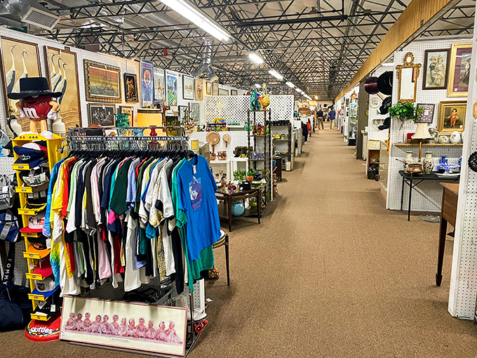 Vintage clothing racks offer wearable history. That colorful t-shirt collection spans decades of graphic design evolution and questionable fashion choices.