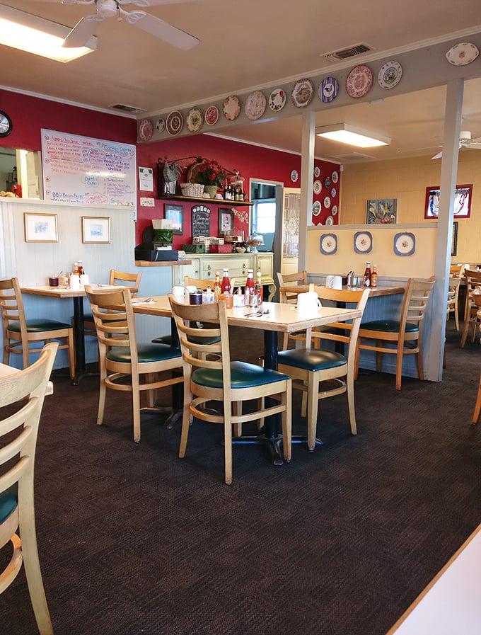 Wooden chairs invite conversation while decorative plates stand guard. This isn't just a dining room&mdash;it's where breakfast memories are made.
