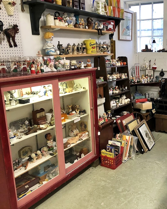 This display case of miniature figurines tells stories of childhood and craftsmanship. Each tiny face holds expressions frozen in time decades ago.