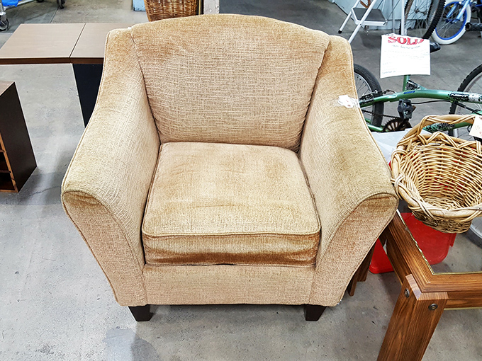 This neutral armchair isn't just waiting for a new home; it's practically begging for a cozy corner and someone with a good book.