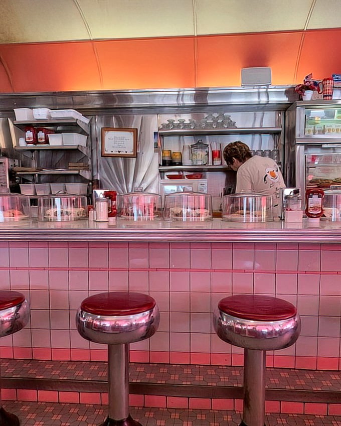 Where the magic happens: pink-tiled counter perfection where coffee flows and friendly conversation is always on the menu.