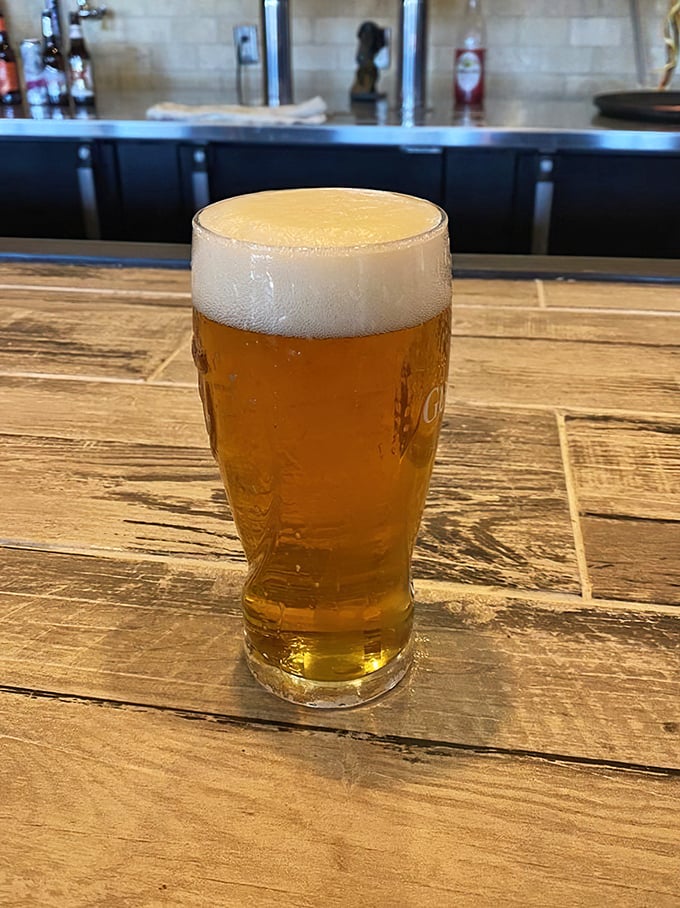 A perfectly poured beer with that ideal foam-to-liquid ratio&mdash;the unsung hero of any great burger experience.