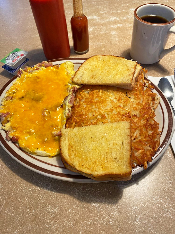 Cheese melting like a sunset over an omelet landscape, with toast soldiers standing guard. This is breakfast worth setting an alarm for.