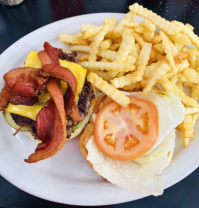 A burger that doesn't need Instagram filters &ndash; just honest beef, melty cheese, and bacon that means business, with crinkle-cut fries for backup.