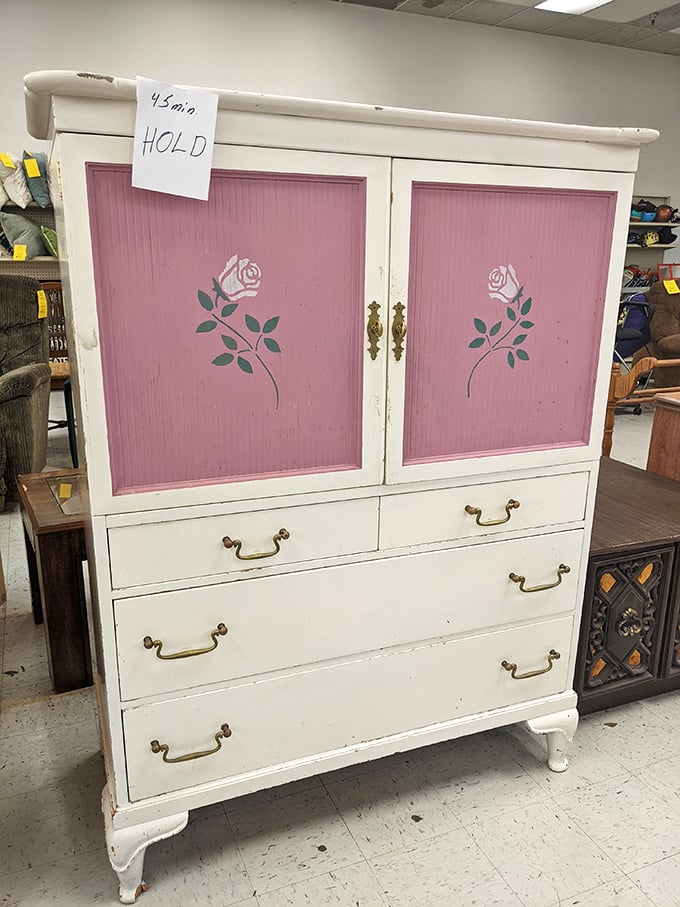 This white and pink cabinet with rose details isn't just furniture &ndash; it's a time machine to someone's 1980s bedroom, "HOLD" tag and all.