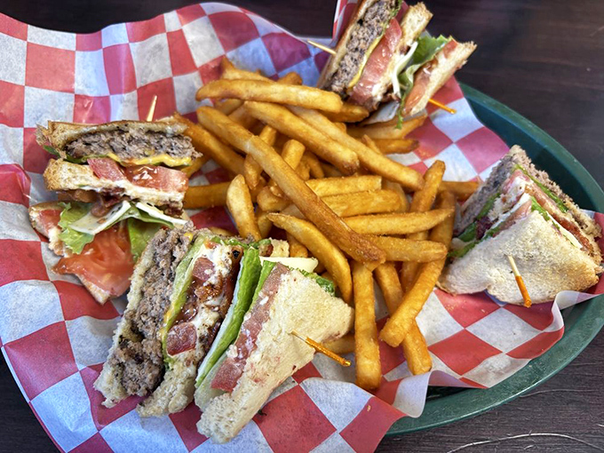 The club sandwich, quartered for maximum enjoyment, stands tall among a sea of golden fries &ndash; a lunch landmark worth the journey.