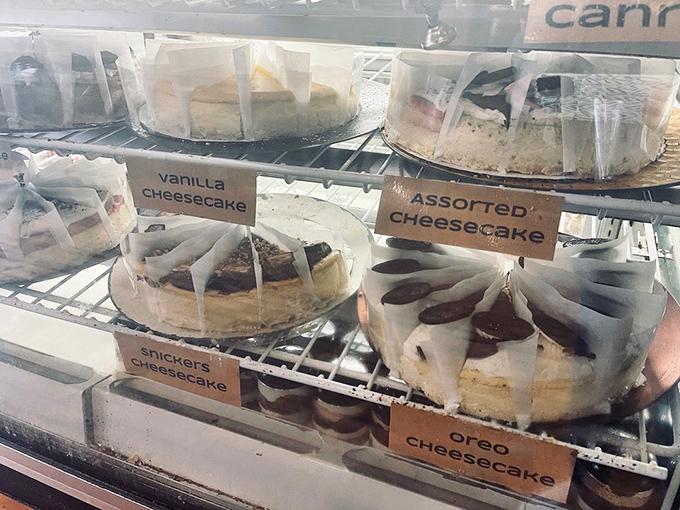 The cheesecake display case&mdash;where dreams are made, diets go to die, and "I'll just have a bite" becomes the lie of the century.