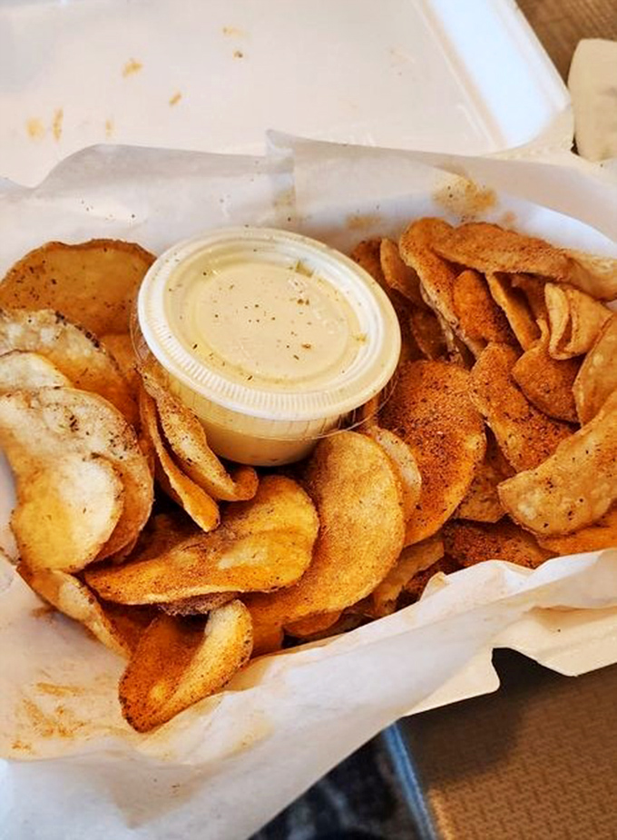 House-made chips with seasoning that clings to each crispy slice. The dip in the middle isn't optional &ndash; it's the chip's destiny.