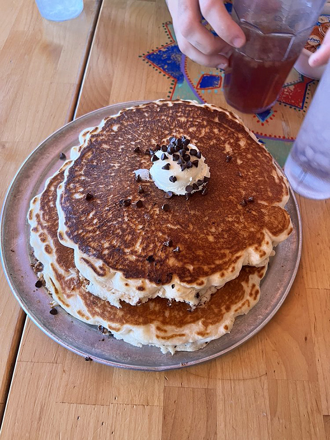 The blueberry pancake arrives with a pat of butter and single blueberry on top&mdash;minimalist breakfast art at its finest. 