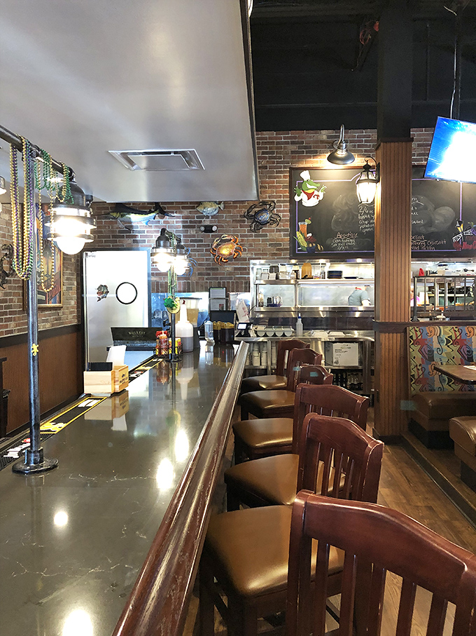 The counter view reveals the heart of Gulf Shores&mdash;where seafood dreams are crafted and Mardi Gras beads hang like promises of good times ahead.