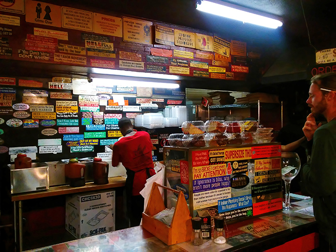 The wall of wisdom behind the counter &ndash; each sign and sticker a chapter in the ongoing barbecue saga of Berkeley.