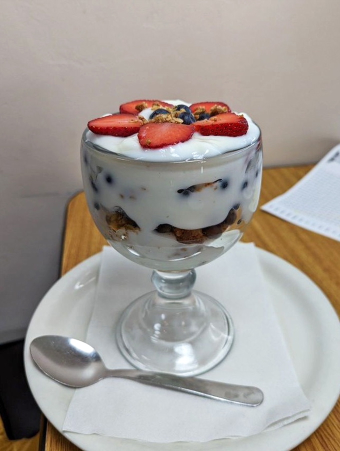 This isn't just dessert, it's therapy in a fancy glass. Fresh berries and yogurt make it practically a health food, right?