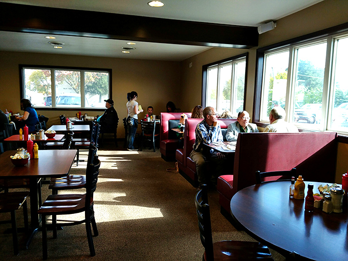 Where strangers become friends over coffee refills. Those red booths have heard more life stories than most therapists.