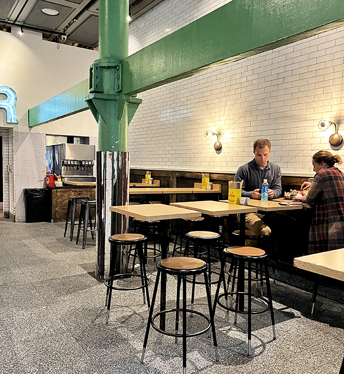 The green support beam isn't just structural&mdash;it's holding up the weight of all our fried chicken expectations. And delivering.