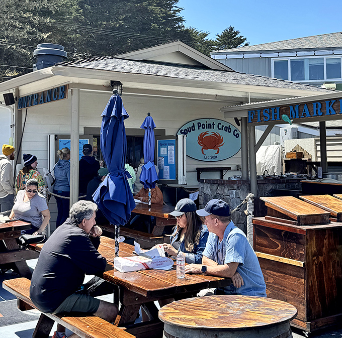 The outdoor dining experience at Spud Point &ndash; where picnic tables become thrones and every bite comes with a side of harbor views.