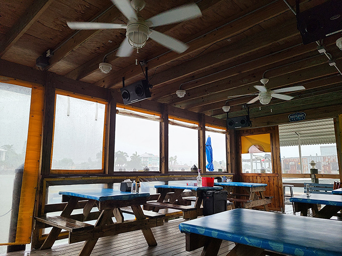 Windows that frame the Florida sunshine, ceiling fans spinning lazily overhead&mdash;this dining area knows exactly what coastal comfort should feel like.