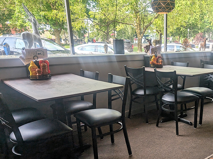 The dining area offers a front-row view of Mansfield life passing by. These tables have hosted countless celebrations, first dates, and regular Tuesday night dinners.