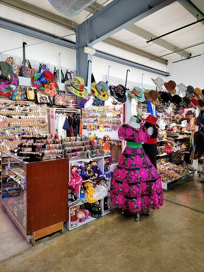 A rainbow explosion of traditional Mexican dresses transforms shopping into a cultural journey—each stitch telling stories that cross borders and generations.