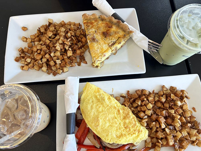 Breakfast harmony achieved: golden quiche and fluffy omelet sharing a plate with those addictive breakfast potatoes everyone fights over.