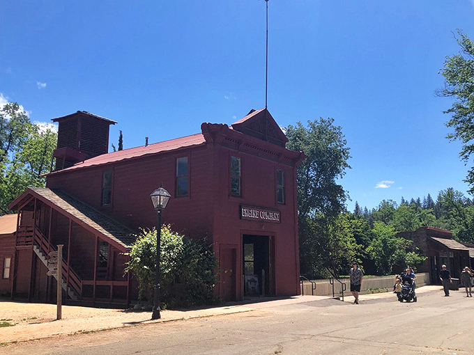 The Engine Company's bright red facade stands ready for action, a colorful reminder of community priorities in the days before insurance apps.
