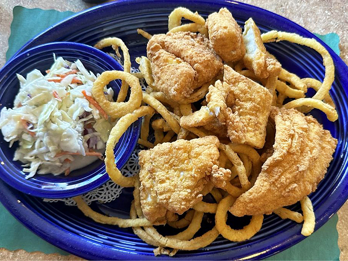 Fish so perfectly fried it practically has a halo. The coleslaw provides the tang, the onion rings provide the crunch, your stomach provides the gratitude.