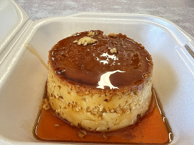 Flan so smooth it could talk its way out of a parking ticket. Caramel pooling around custard perfection.