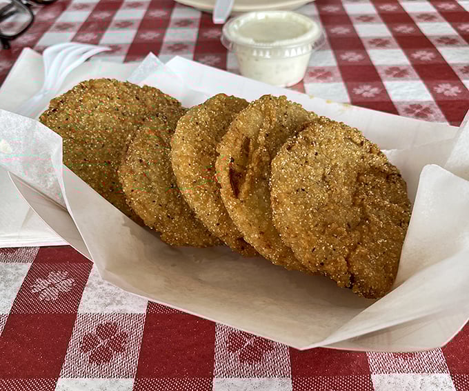 More fried green tomatoes looking like golden medals of deliciousness. If vegetables always dressed like this, kids wouldn't need to be bribed to eat them.
