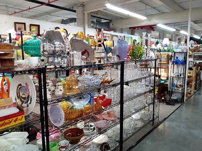 Crystal, colored glass, and delicate dishes catch the light and imagination &ndash; each piece silently whispering stories of dinner parties long past.