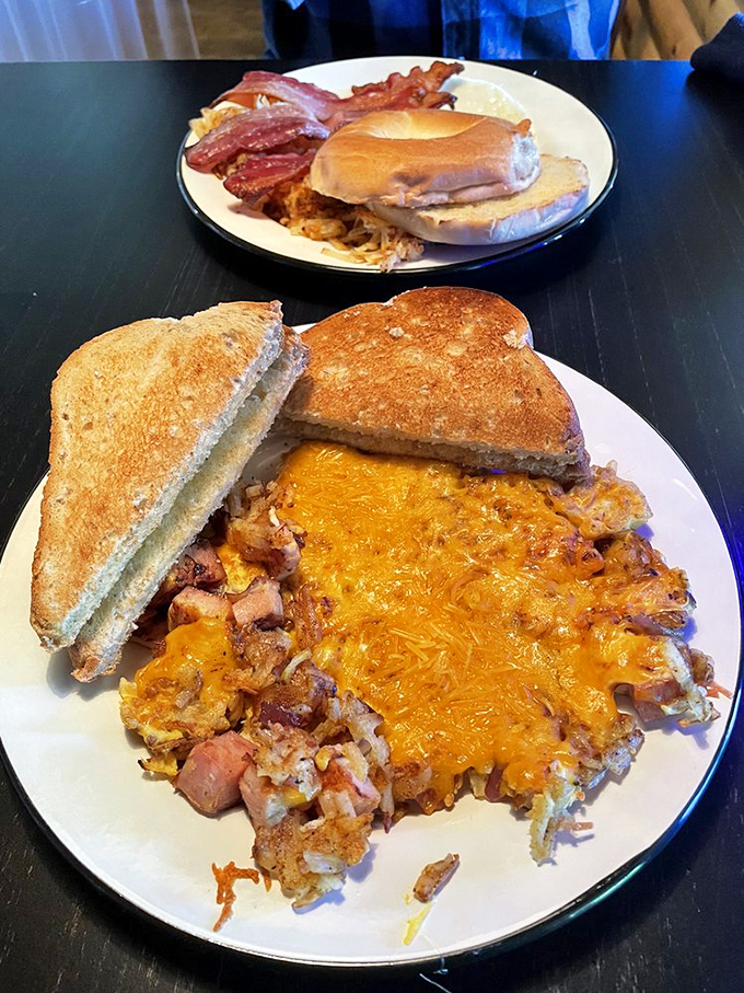 Breakfast of champions! Golden hashbrowns and melted cheese with toast &ndash; the kind of plate that fuels a day of paddling or simply more eating.