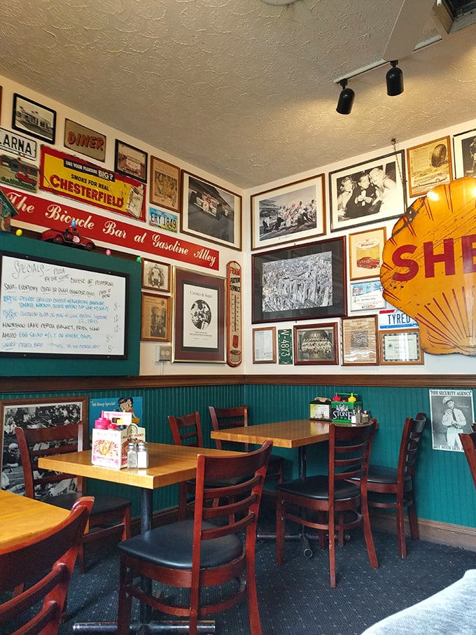 Every inch of wall space tells a story at Gasoline Alley. The vintage signs and memorabilia create a museum where the main exhibit is fantastic food.