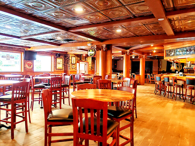 The dining room glows with amber warmth, where every wooden table seems to have hosted a thousand good conversations.