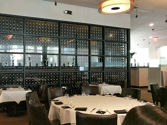 The wine wall stands like the library of Alexandria for oenophiles. Knowledge is power, but in this case, it's also delicious.