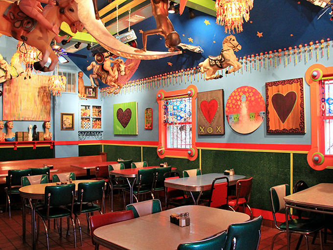 Another dining room reveals heart-themed artwork watching over patrons, proving that at PaperMoon, even the walls wear their emotions on their sleeve.
