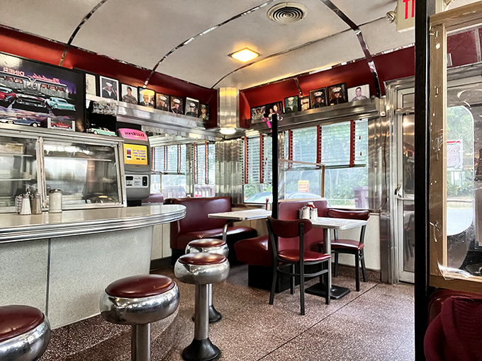The curved ceiling and gleaming surfaces create a dining capsule where calories don't count and conversations flow as freely as the coffee.
