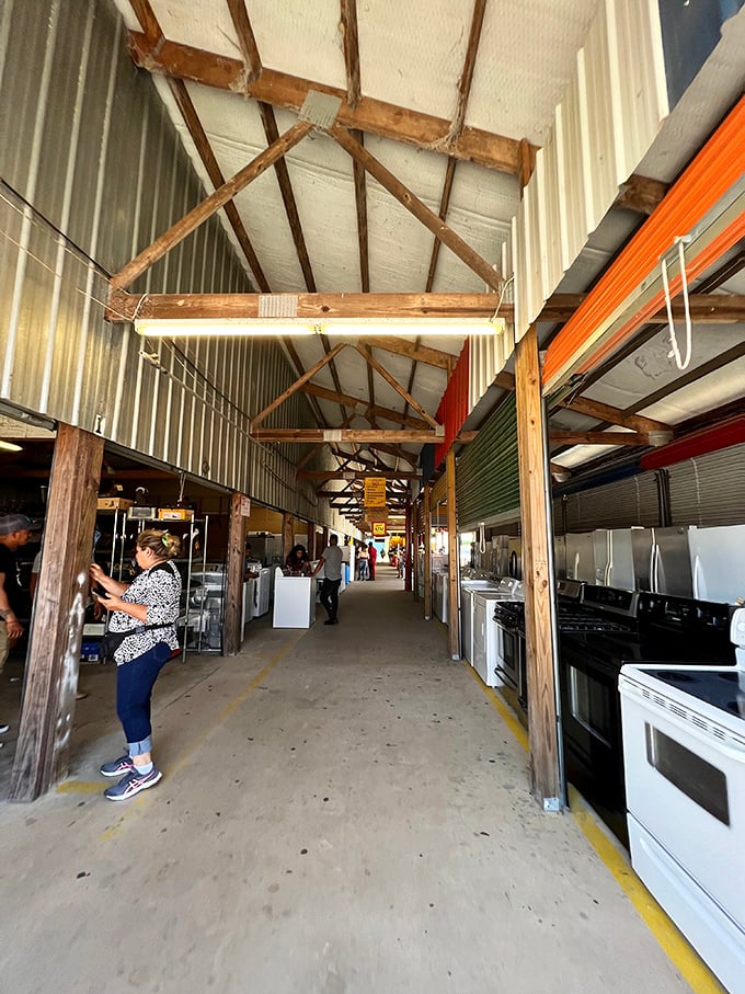 Appliance alley stretches into the distance, where stoves and refrigerators stand at attention, waiting for new homes and second chances.