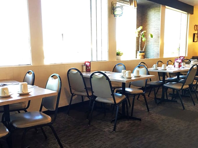 Simple tables set with care, waiting for the breakfast rush like Broadway stages before the curtain rises.