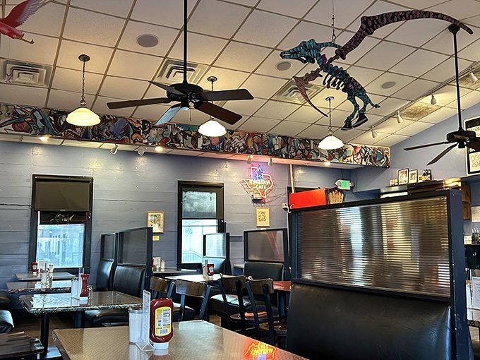 The whimsical ceiling decor includes what appears to be a dinosaur skeleton&mdash;because nothing says "fun dining experience" like extinct reptiles watching you eat.