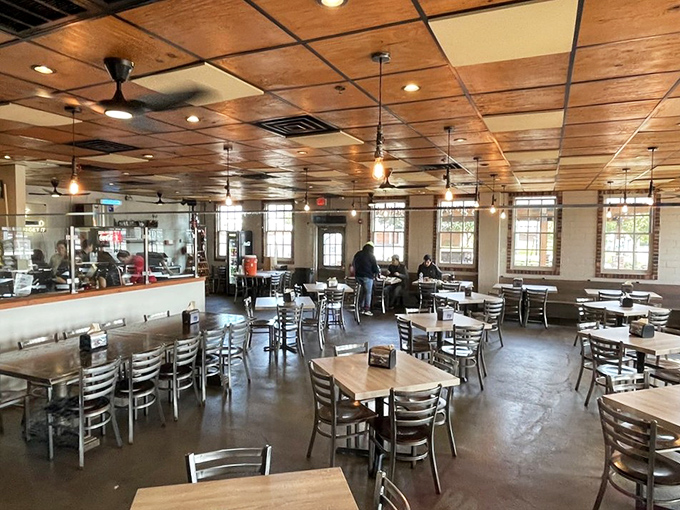 The dining room's rustic simplicity lets you focus on what matters: that tray of smoked perfection heading toward your table.