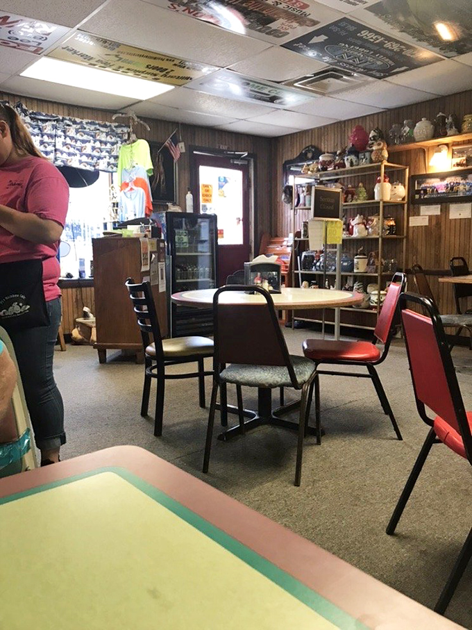 The dining room feels like a community scrapbook come to life, where every shelf item has a story waiting to be told.