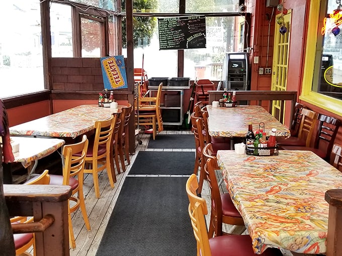 No interior designer was harmed in the making of this dining room. Those tablecloths have witnessed more seafood love affairs than a romance novel.
