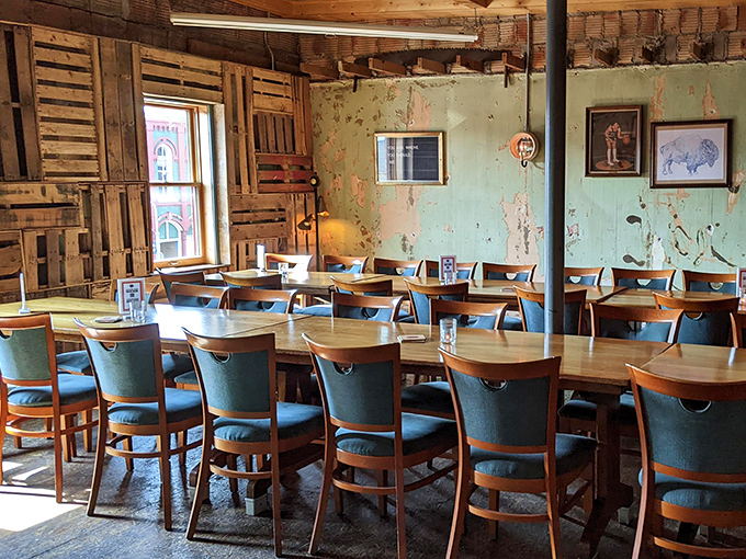 A dining room where wooden crates become wall art and every chair looks like it has a story to tell. Distressed paint never looked so intentional.