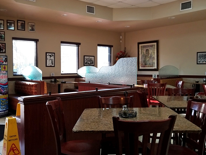 The dining room's frosted glass dividers and photo-lined walls create little islands of conversation &ndash; each table its own celebration of flavor.