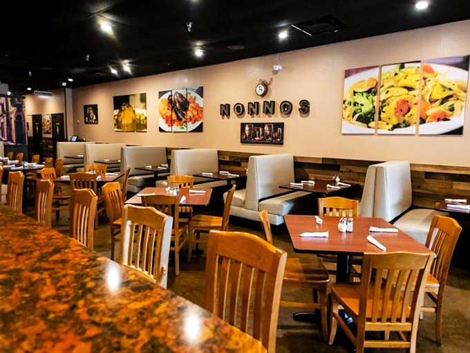 The warm, inviting interior features food photography that doubles as both decoration and a delicious preview of coming attractions.