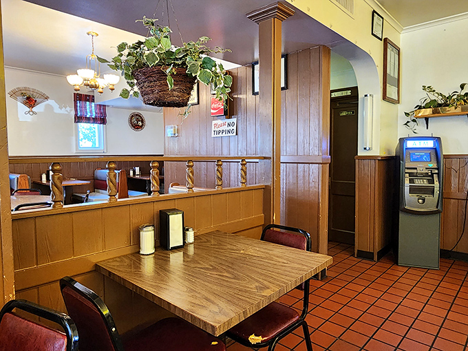 Wood paneling, hanging plants, and booth dividers&mdash;this isn't retro d&eacute;cor, it's simply a place that never saw reason to change what works.